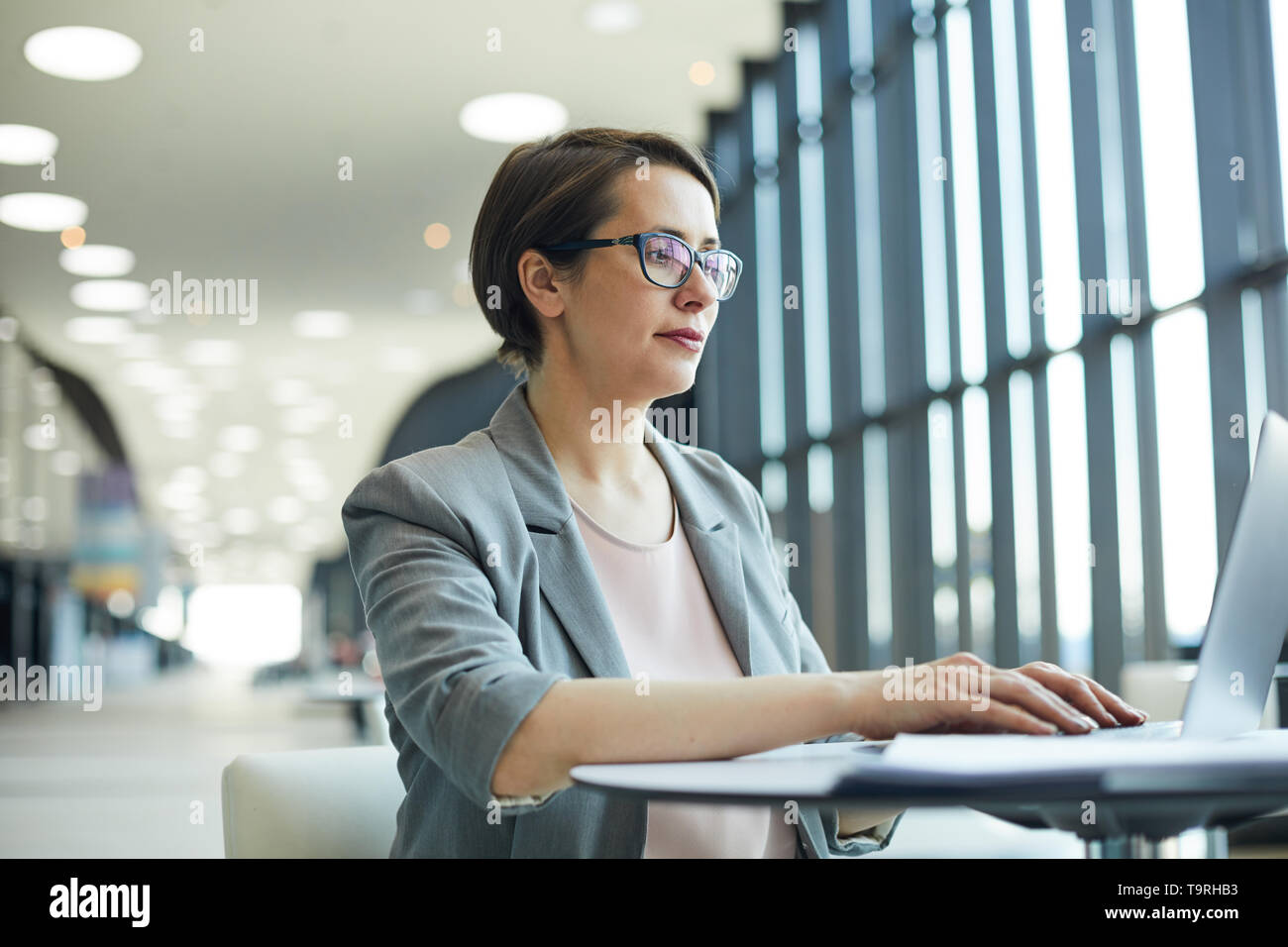 Attractive middle aged business woman using hi-res stock photography ...