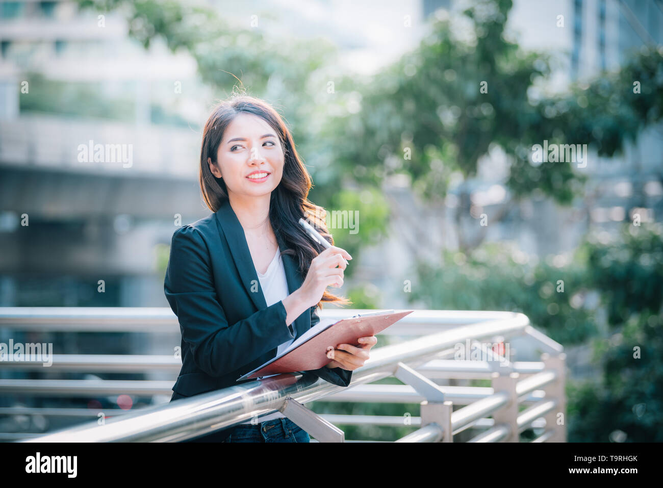Portrait of business woman happy smile holding check list on clipboard ...