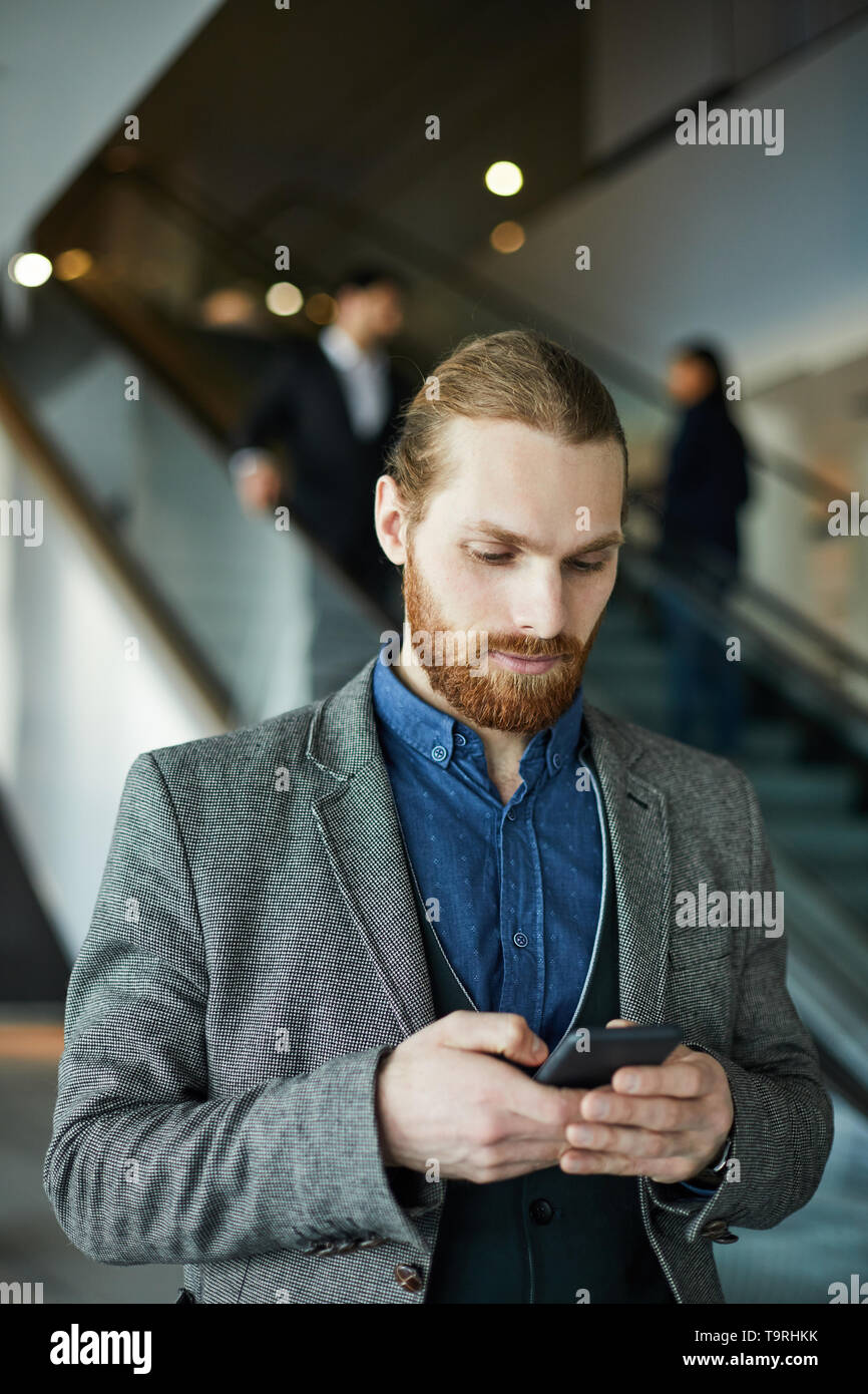 Airport escalator businessman smartphone hi-res stock photography and ...