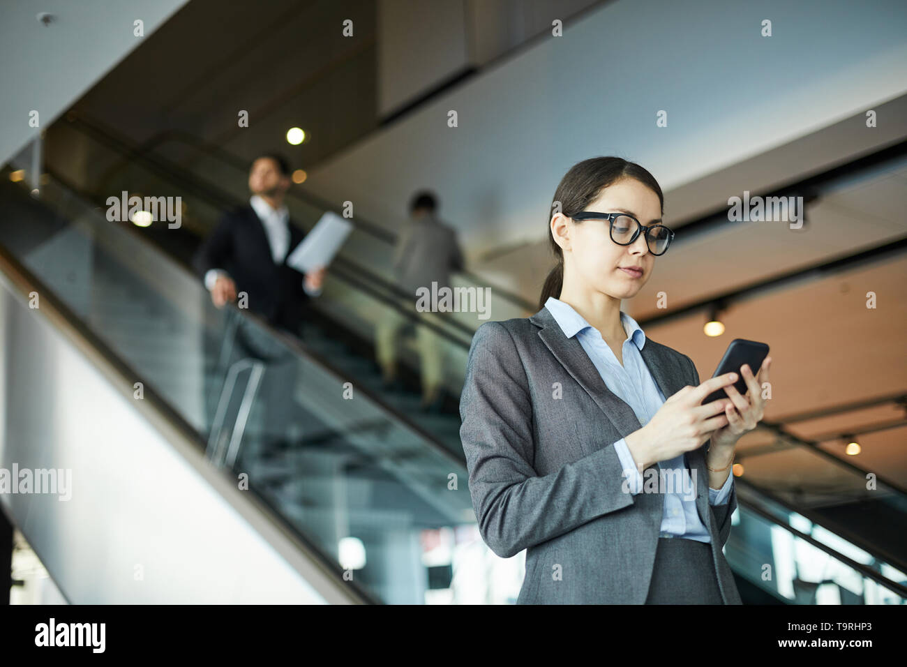 Young woman checking email on smartphone Stock Photo - Alamy