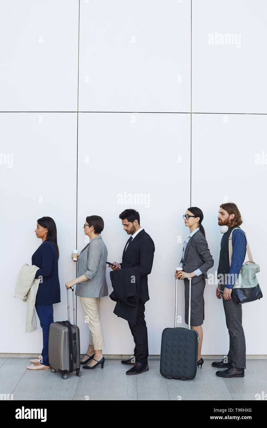 People standing in line during airport check-in Stock Photo - Alamy
