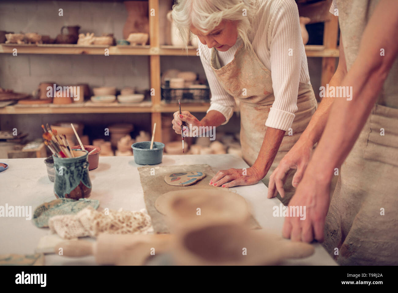 Woman leaning forward close hi-res stock photography and images - Alamy