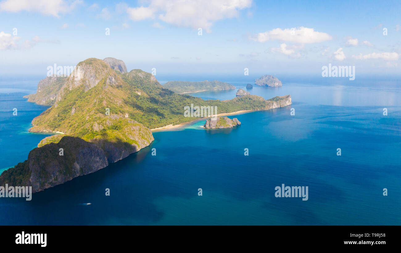 Seascape, view from above. Rocky islands covered with rainforest. El ...