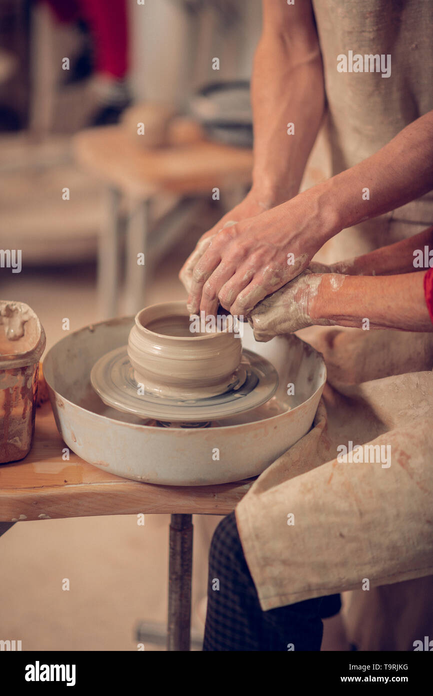Clay pot being made on the pottery wheel Stock Photo - Alamy