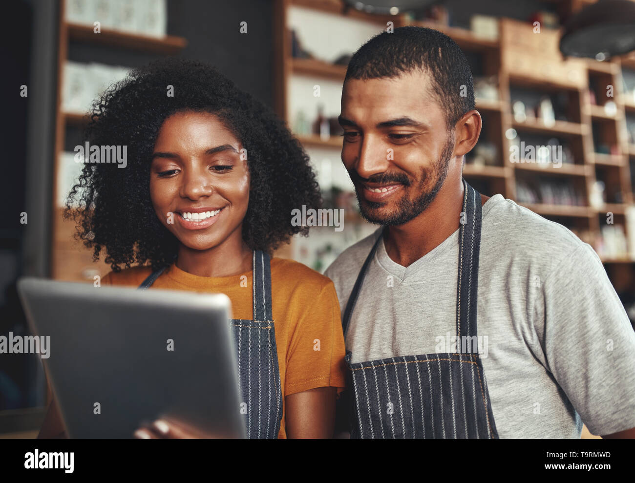 Afro business couple using hi-res stock photography and images - Alamy