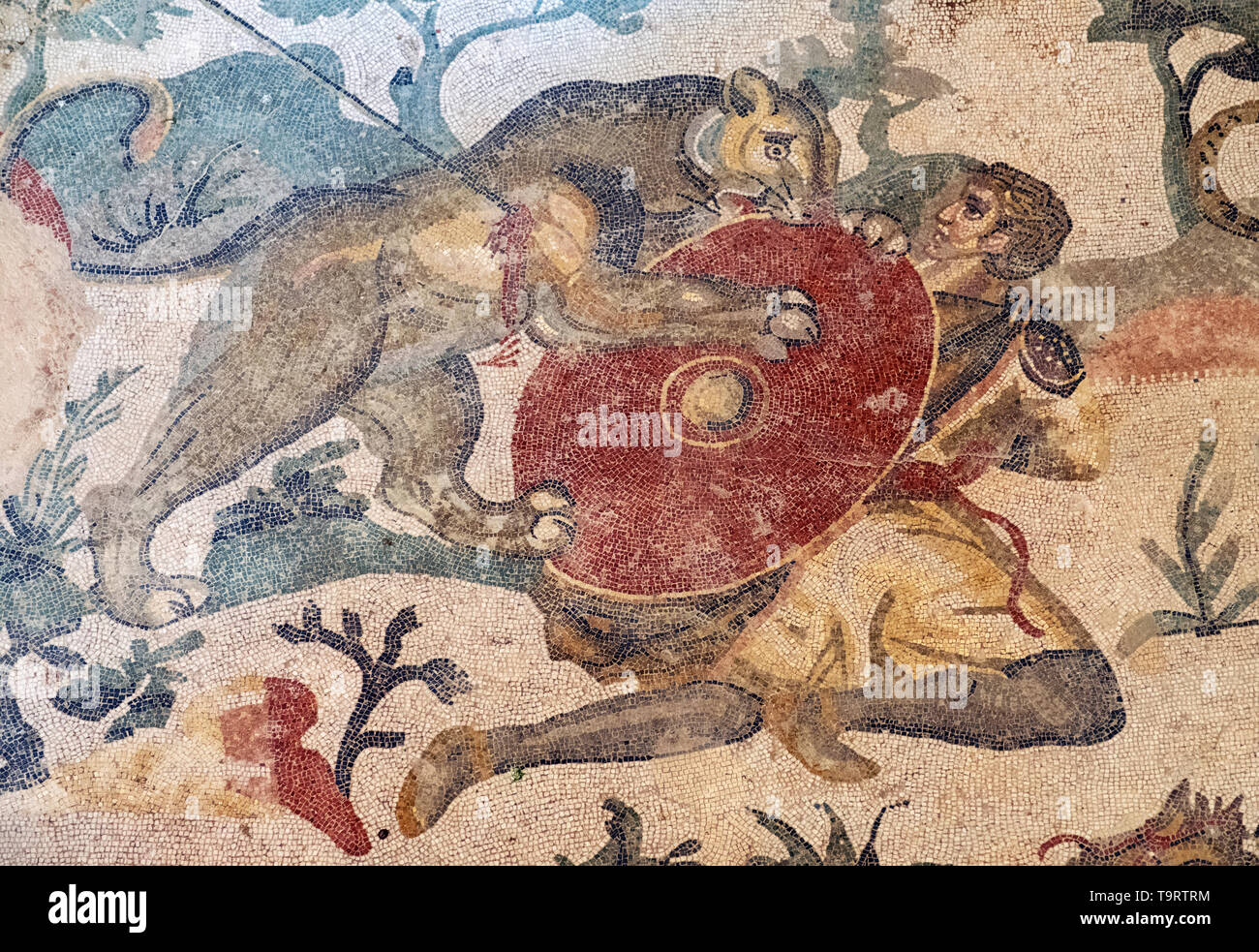 A lioness attacks a hunter on the great hunt mosaic hi-res stock ...