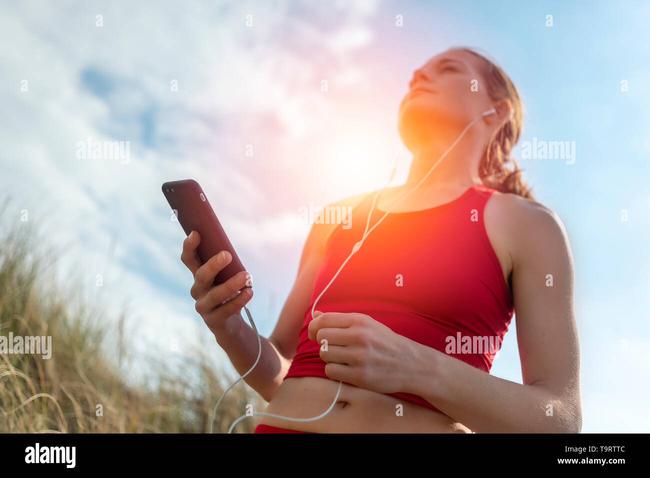 Woman runner music hi-res stock photography and images - Alamy