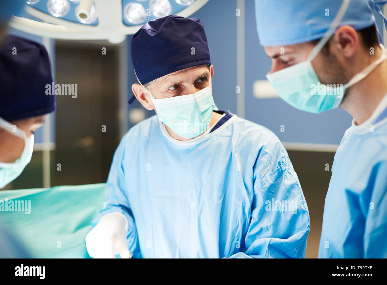 Male surgeons during the very important operation Stock Photo - Alamy