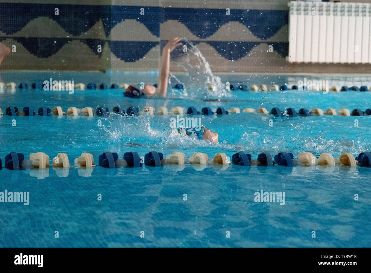 Kid swim backstroke hi-res stock photography and images - Alamy