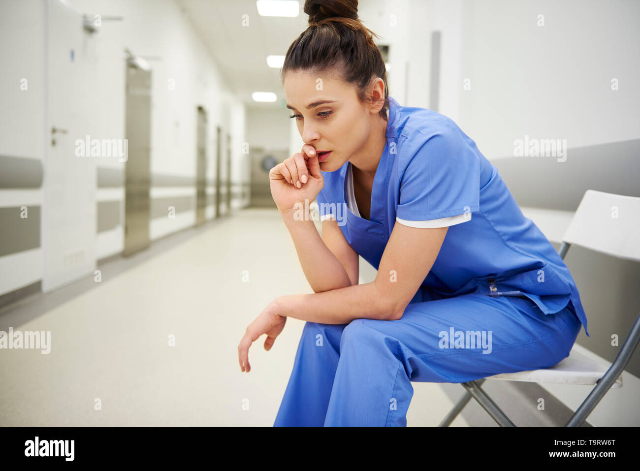 Stressed and worried doctor after long day at work Stock Photo - Alamy