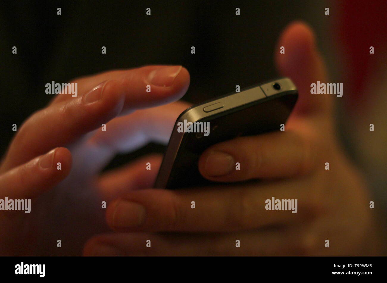 two hands using a smartphone Stock Photo - Alamy