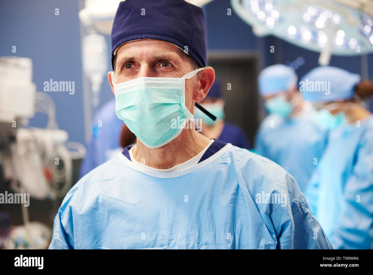Portrait of senior surgeon ready for an operation Stock Photo - Alamy