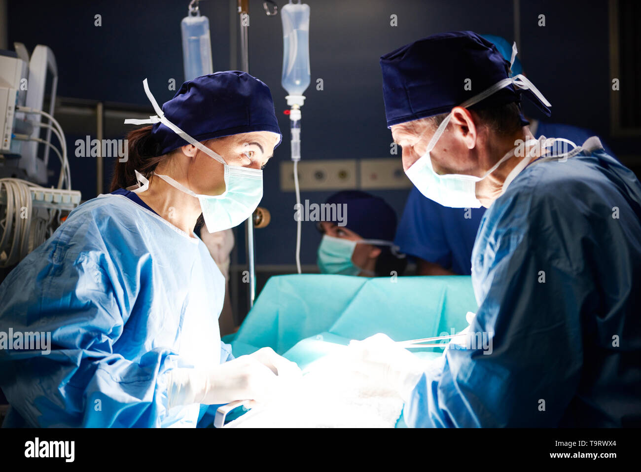 Surgeon team working together in hi-res stock photography and images ...