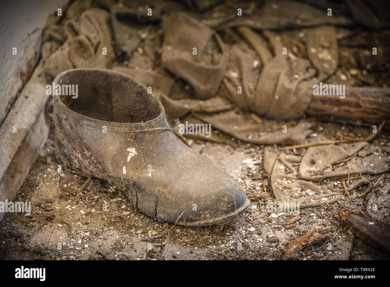 Old dirty boot in an abandoned old farm in Belarus, Chernobyl exclusion ...