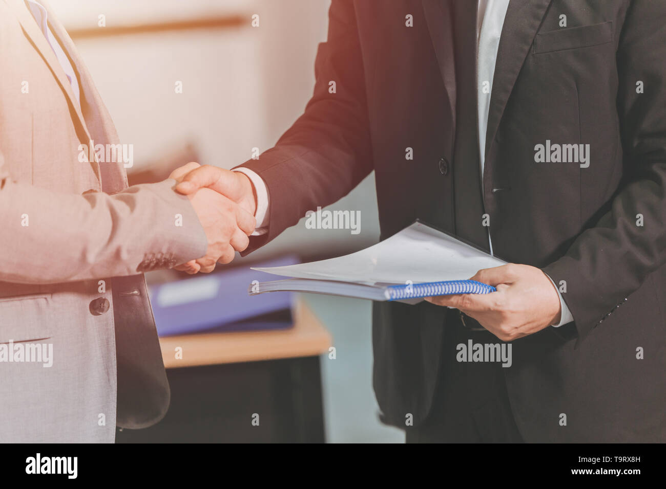 businessman hand shake together for project successful job done or ...
