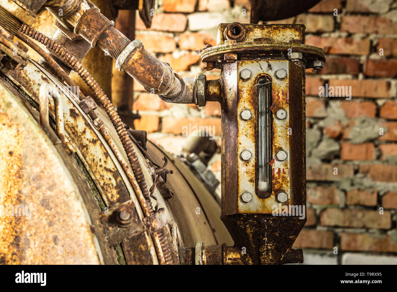 Rusted liquid meter of an ancient machine in a abandoned factory Stock ...