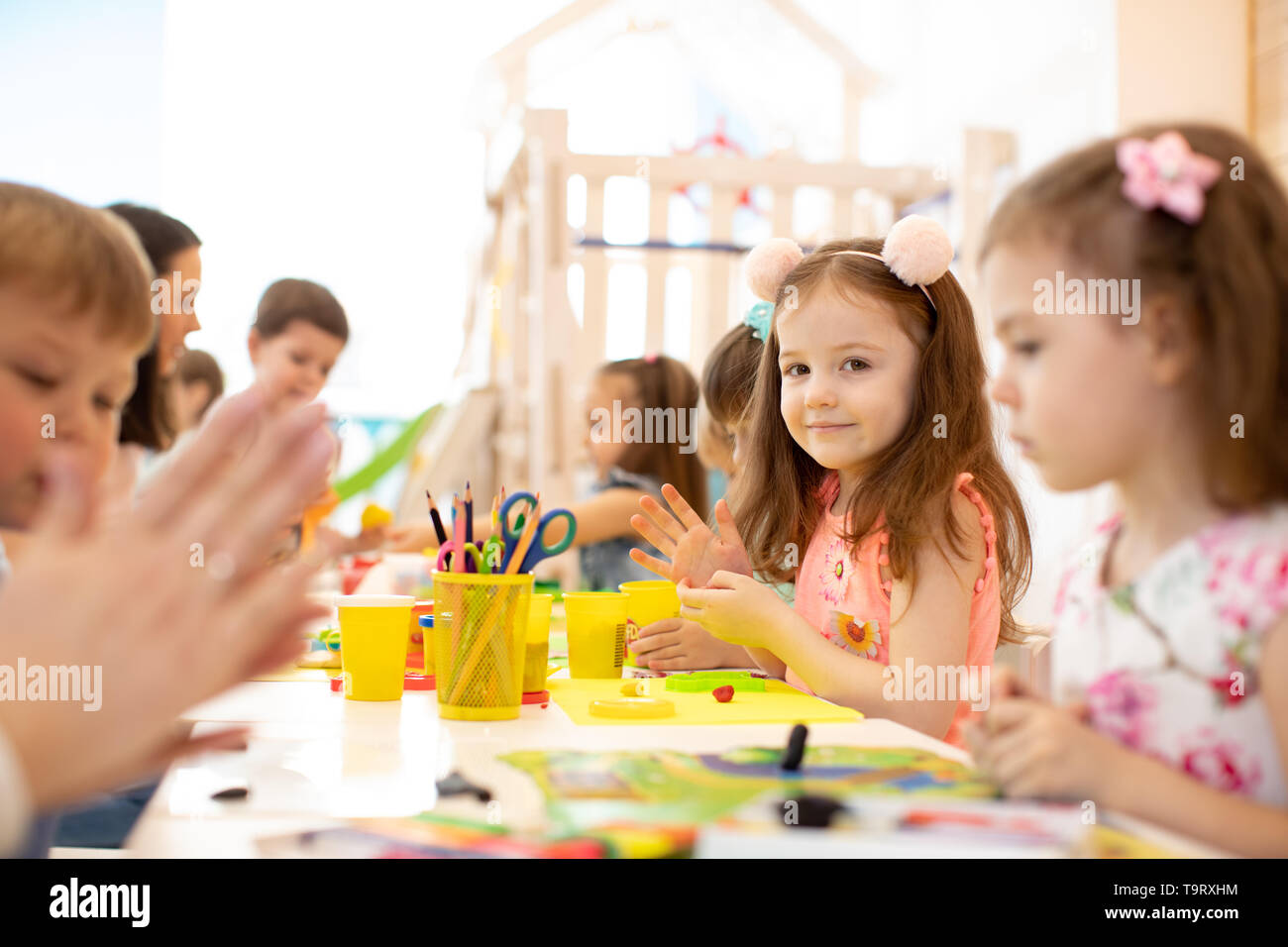 Happy kids doing arts and crafts hi-res stock photography and images ...