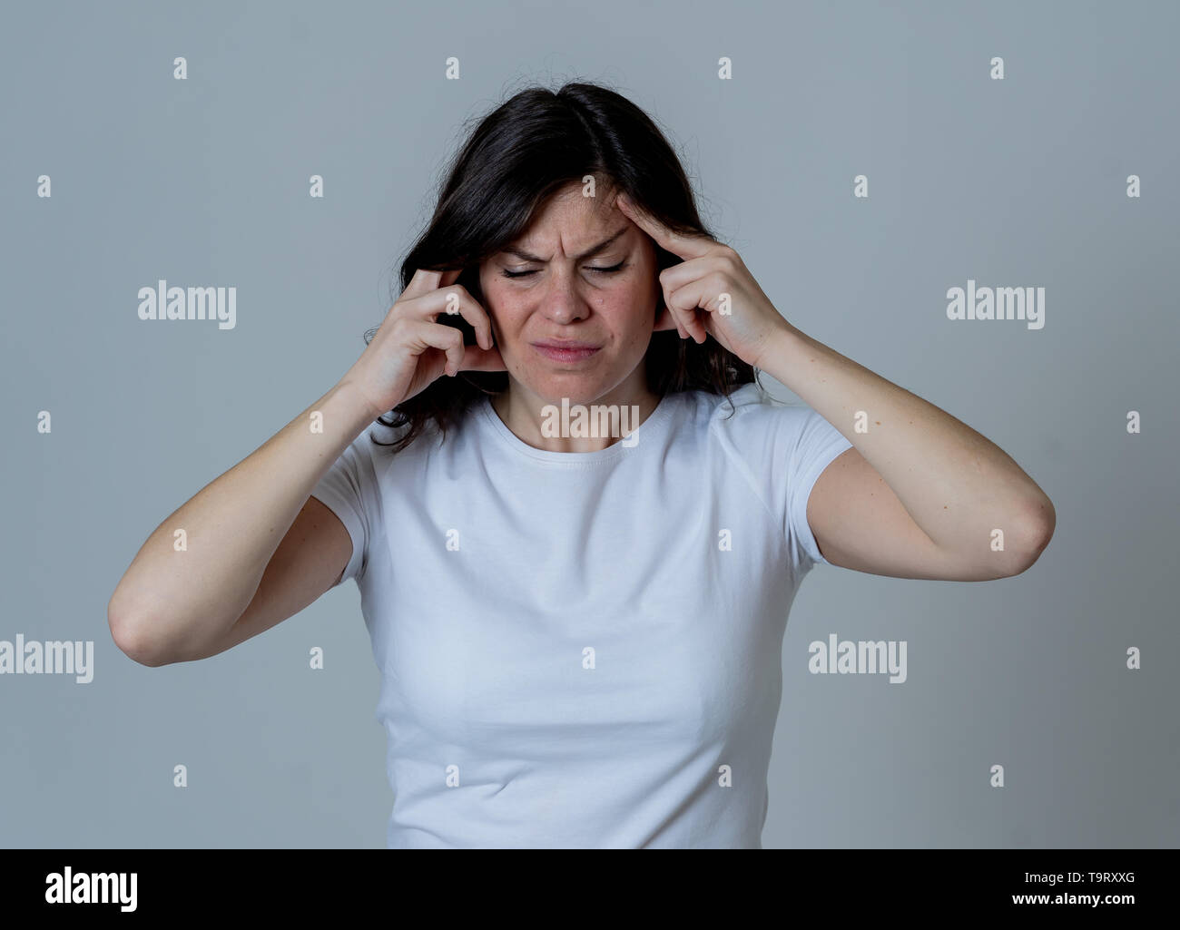 Close up portrait of young sad woman, serious and concerned, looking ...