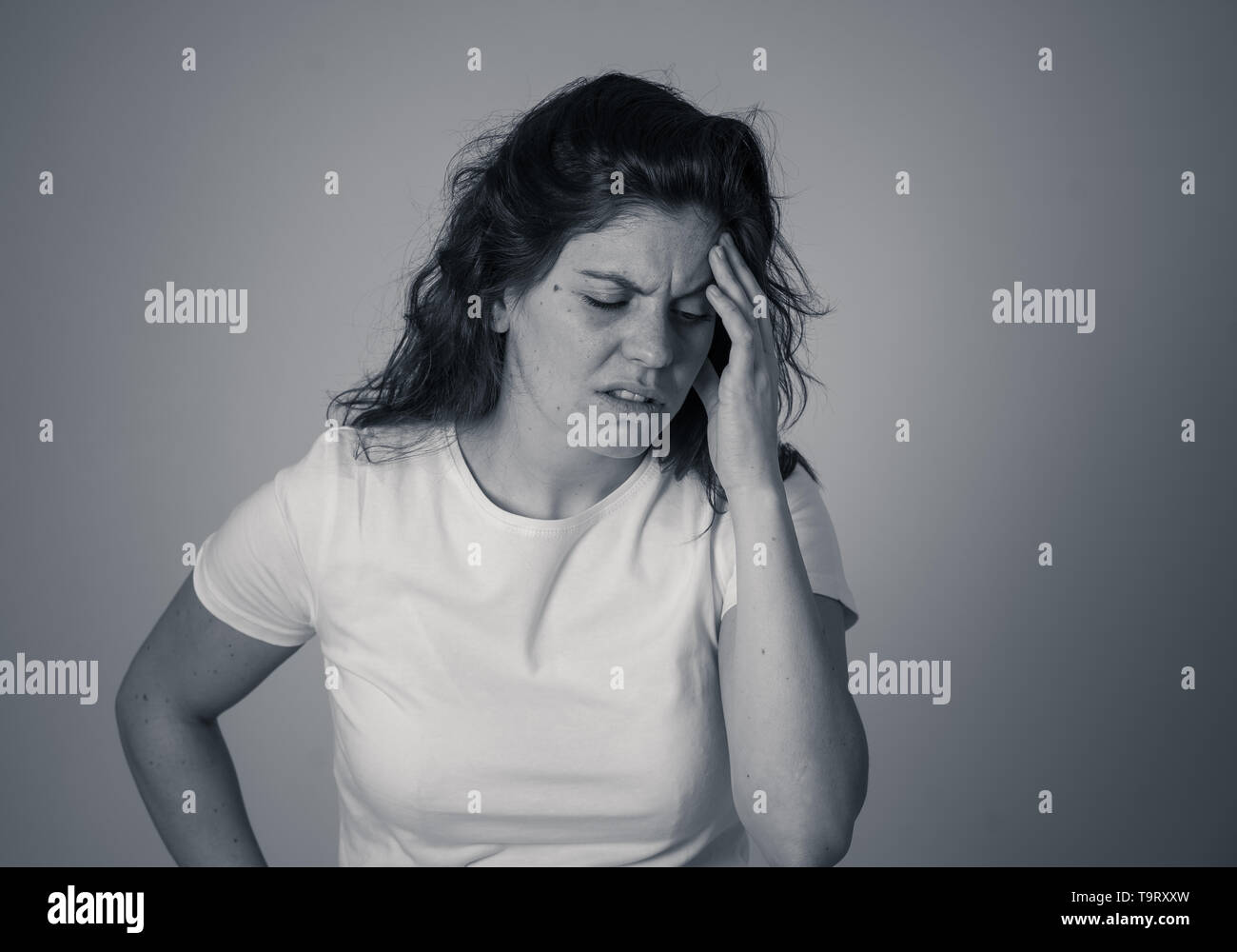 Close up portrait of young sad woman, serious and concerned, looking ...