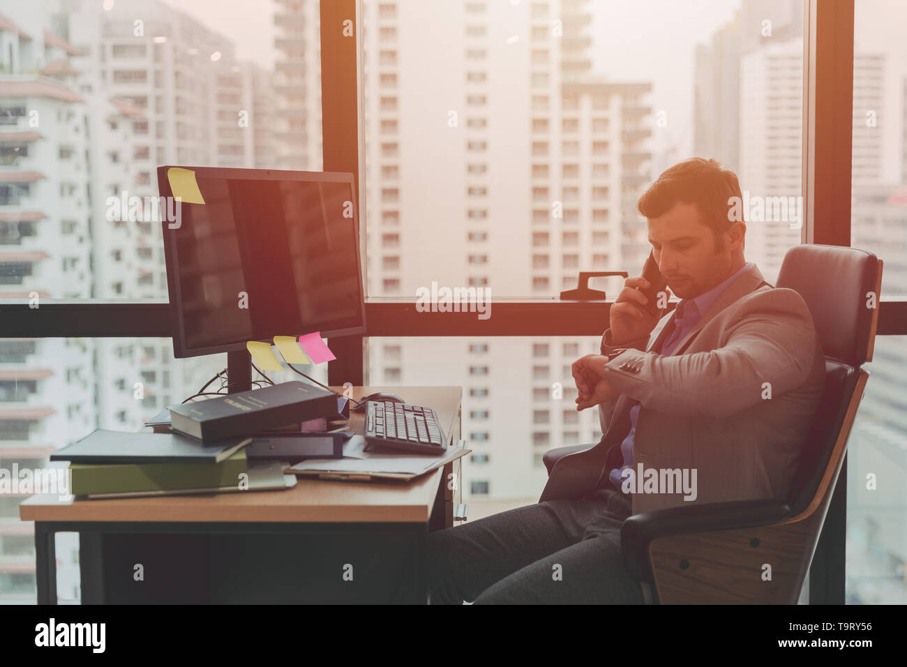 Working hours, afternoon brake times concept, Businessman looking at ...