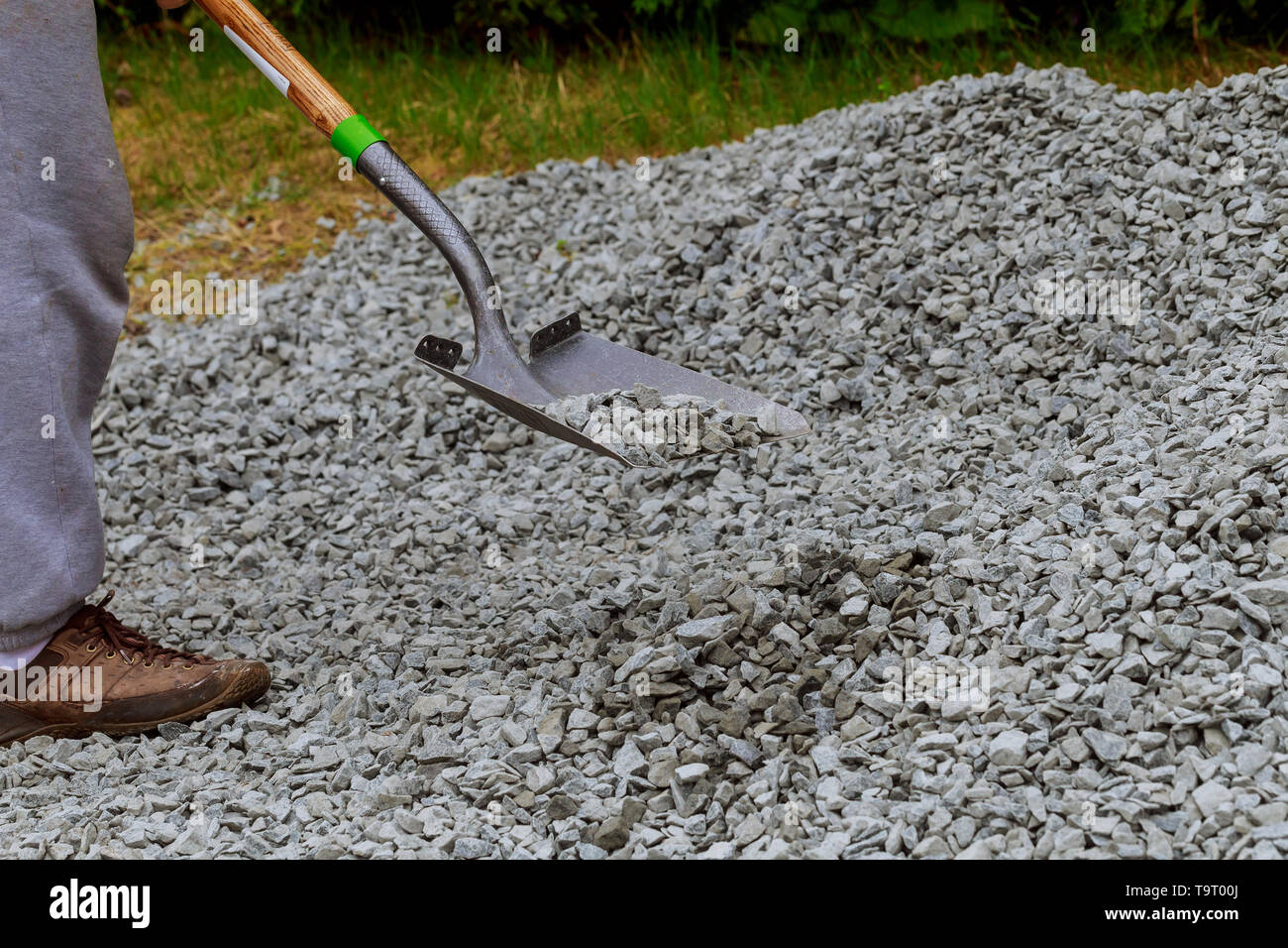 Shovel with gravel pile at home construction site in progress with ...