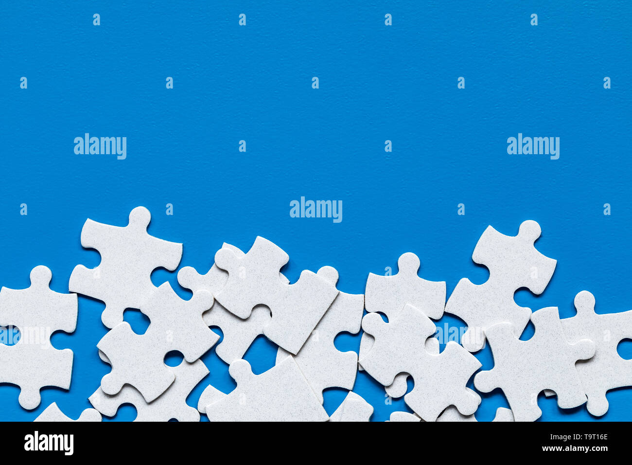 Unfinished white jigsaw puzzle pieces. Fill in pieces of the jigsaw ... Unfinished white jigsaw puzzle pieces. Fill in pieces of the jigsaw ...