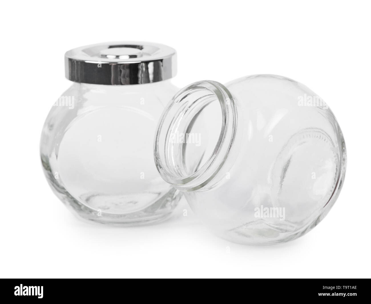 Two small empty glass jars isolated on white background Stock Photo - Alamy