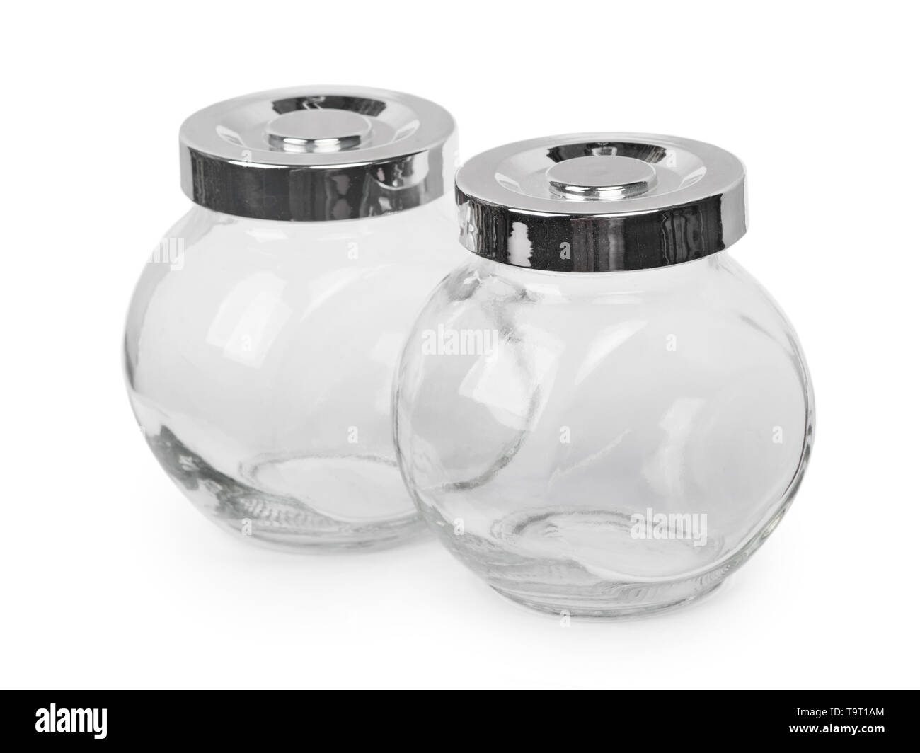 Two small empty glass jars isolated on white background Stock Photo - Alamy
