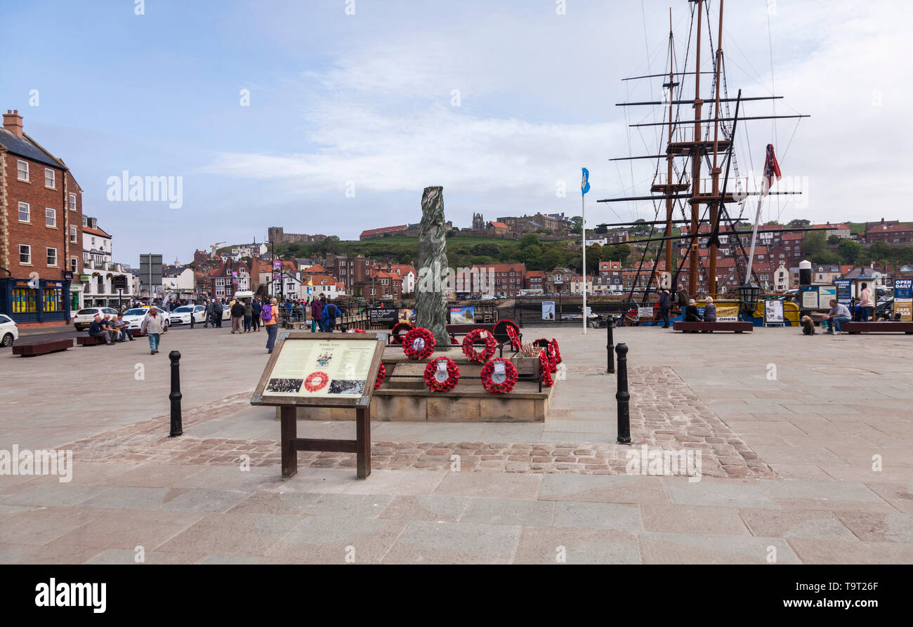 The war memorial in front of the replica of the HMS Endeavour boat at ...