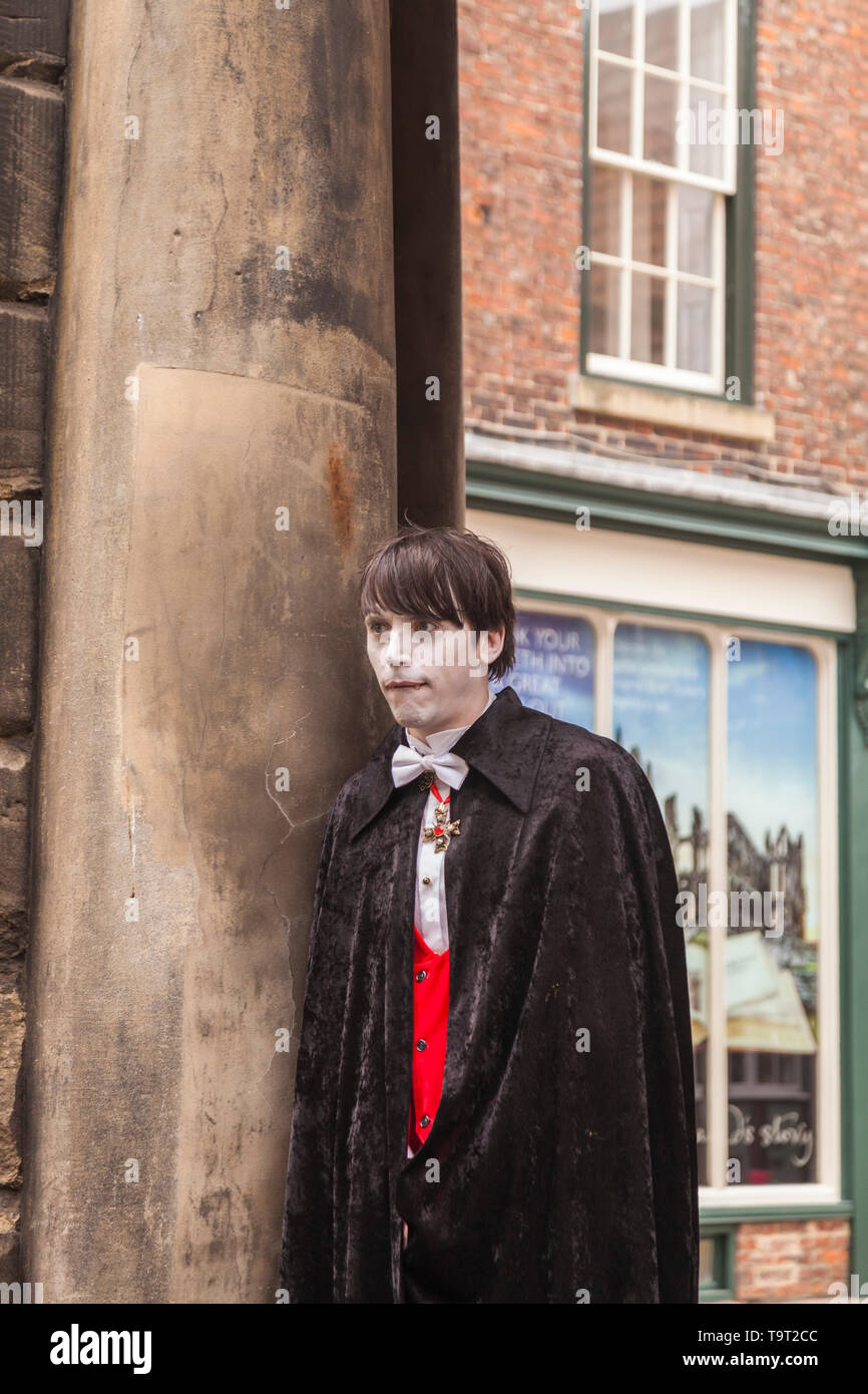 An actor dressed as Count Dracula during filming at Whitby,North ...