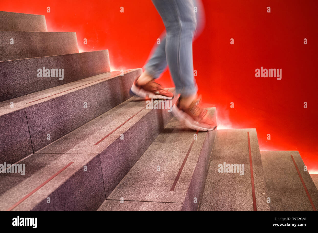 Futuristic backlit modern staircase with female legs walking Stock ...
