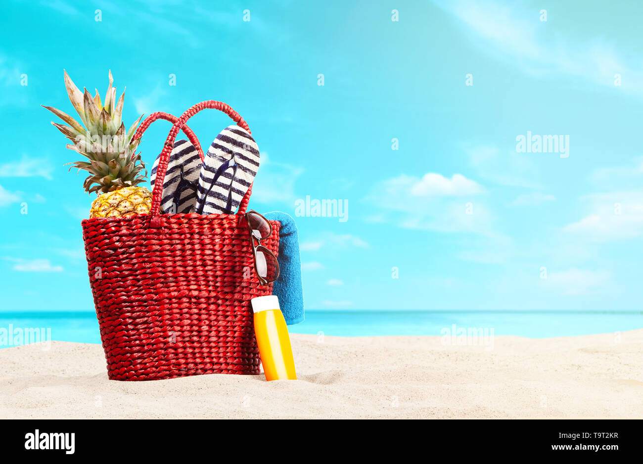 Red beach bag with accessories Stock Photo - Alamy