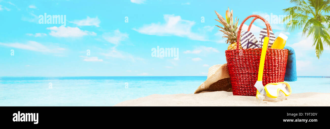 Red beach bag with accessories Stock Photo - Alamy