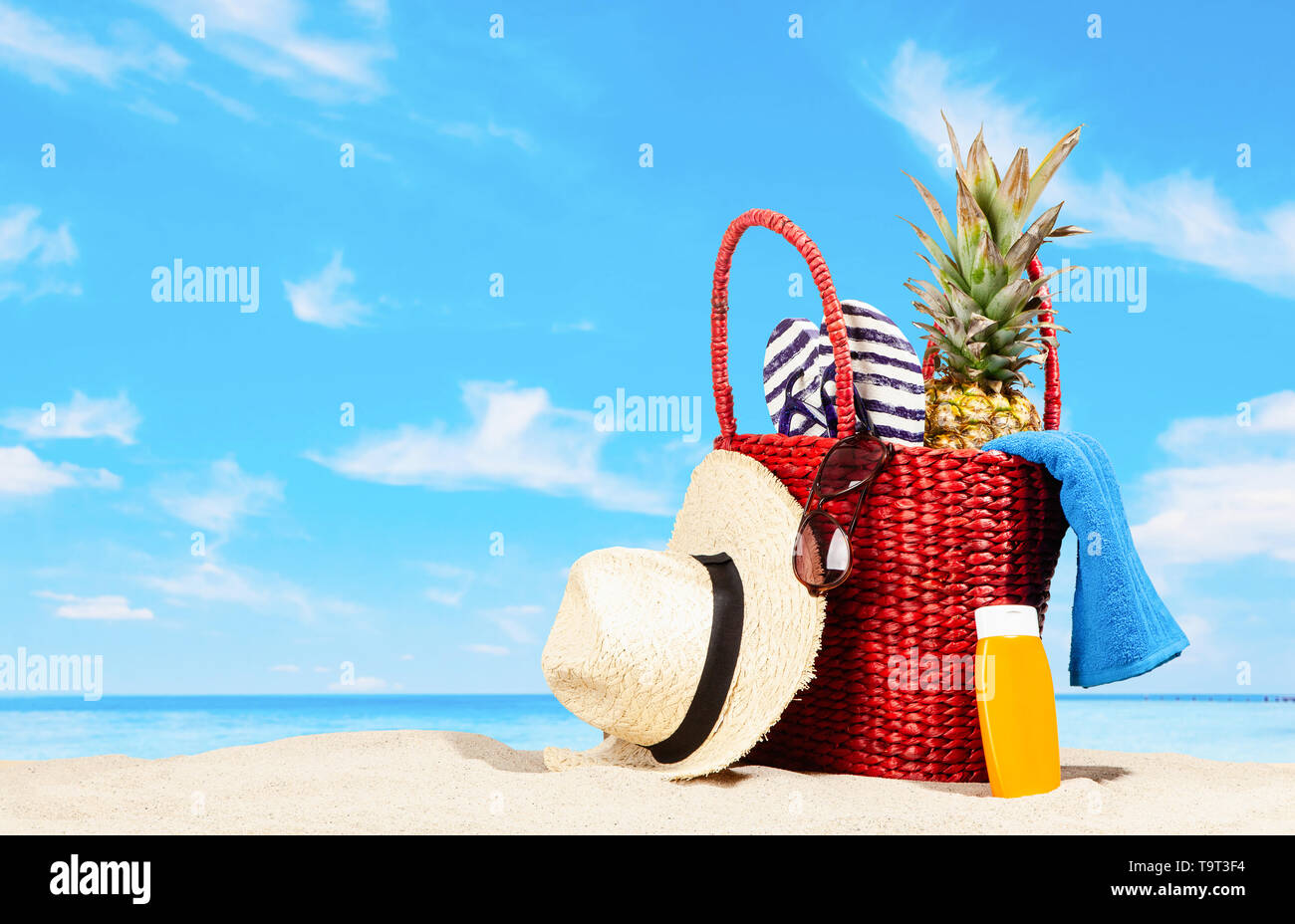 Red beach bag with accessories Stock Photo - Alamy
