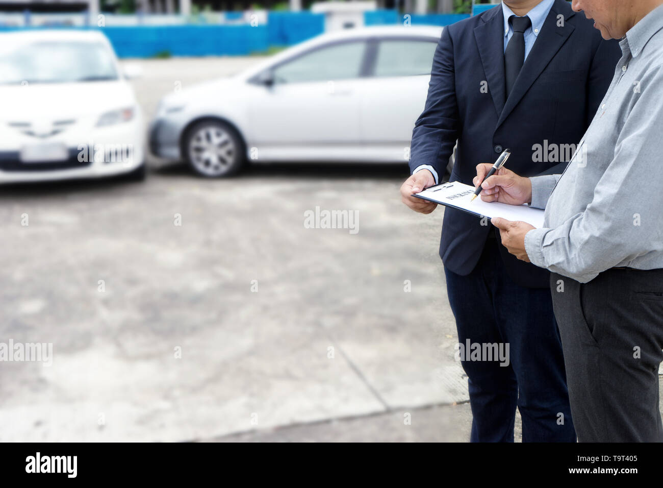 On the road car accident insurance agent examining carcrash owner and ...