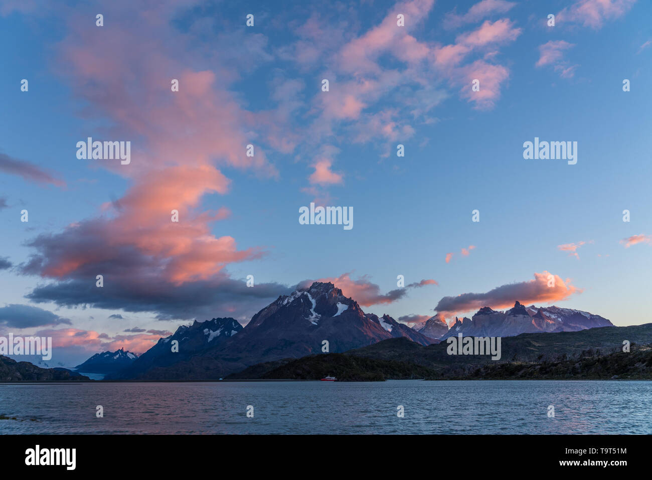 Sunrise light on the clouds over the Paine Massif in Torres del Paine ...