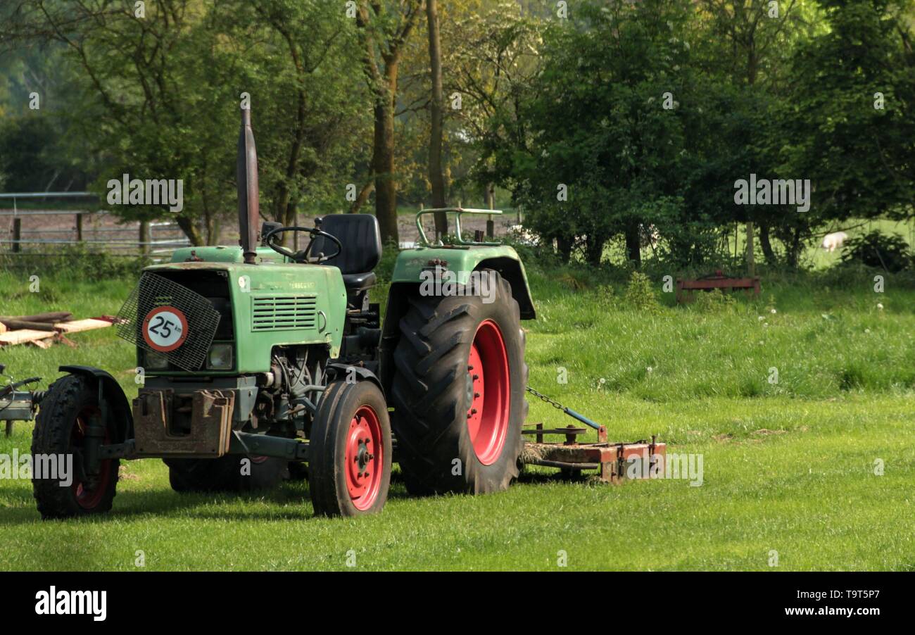 Tractor in typical dutch nature on a spring day in the Netherlands ...