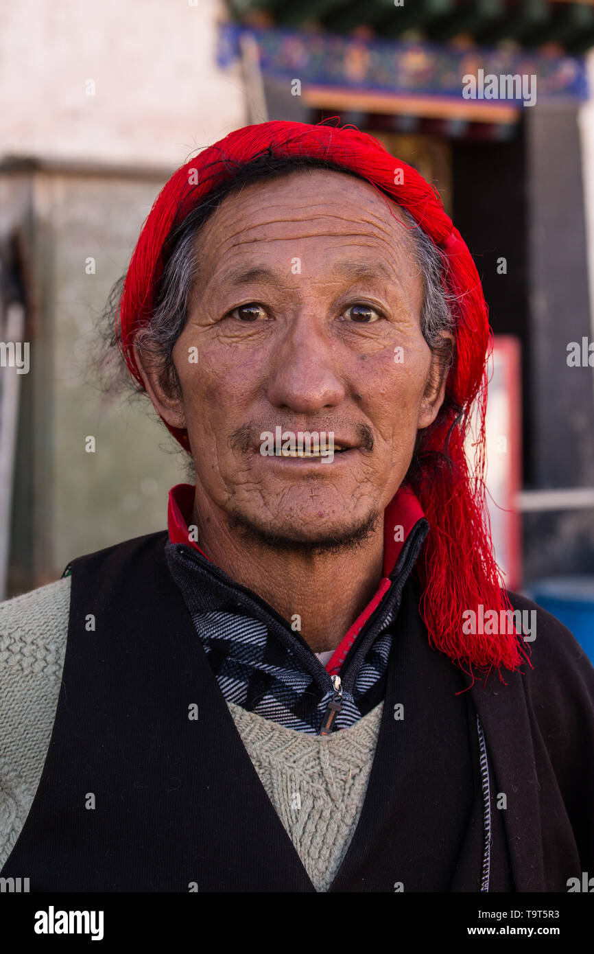 A Tibetan Buddhist pilgrim from the Kham region of eastern Tibet ...