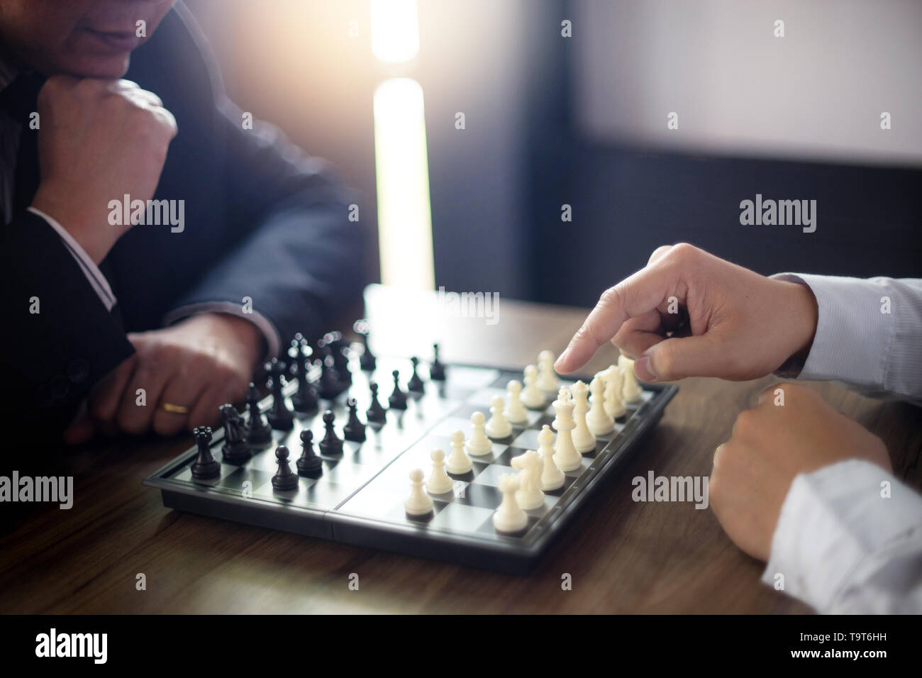 Businessman thinking how to play chess concept business strategy for ...