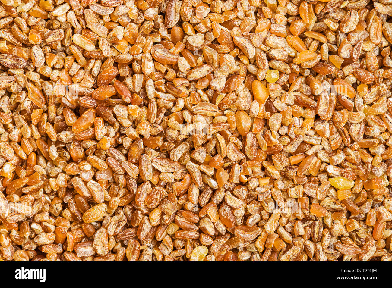Dry bulgur wheat grains. Top view texture Stock Photo - Alamy