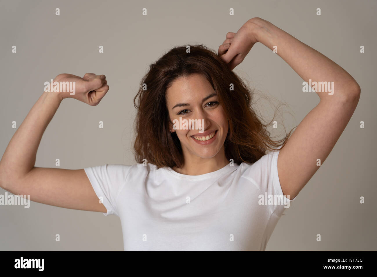 Portrait of Amazed excited woman with red curly hair dancing and making ...