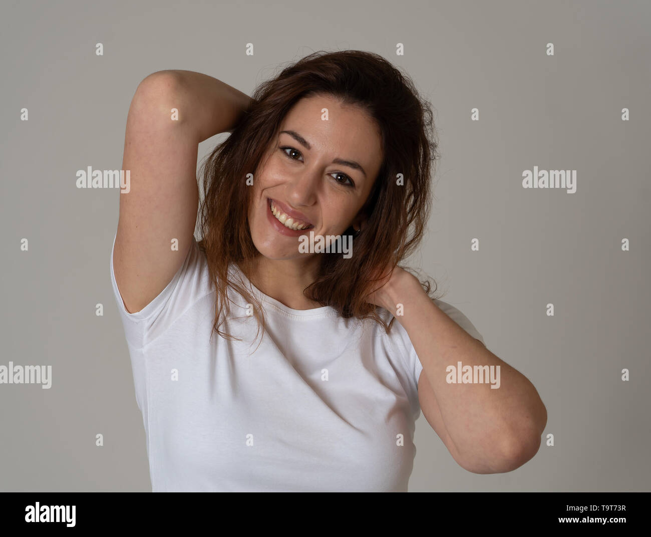 Portrait of Amazed excited woman with red curly hair dancing and making ...