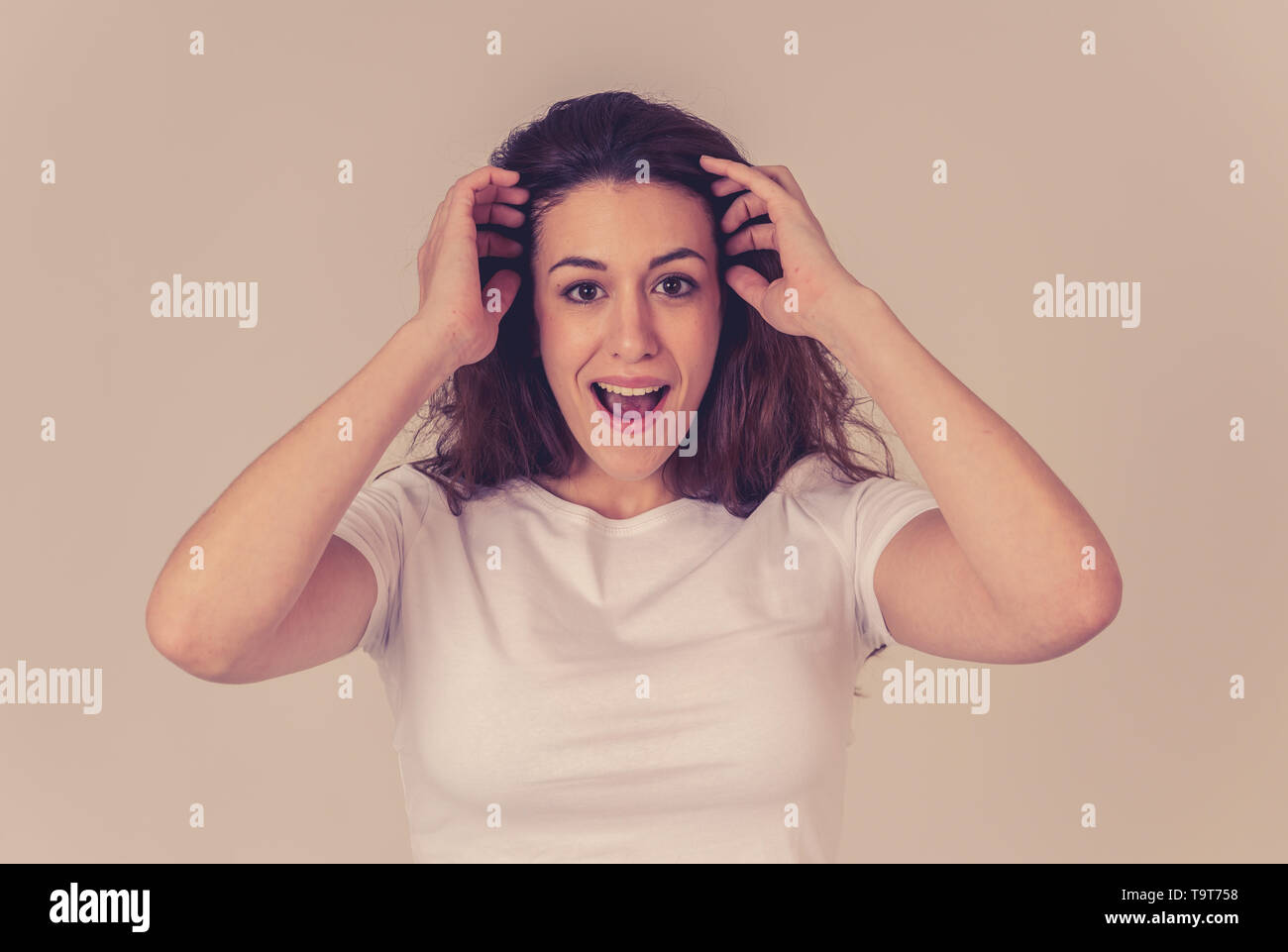 Beautiful young red hired woman with happy face making surprised ...