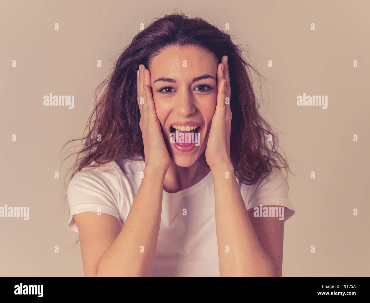 Beautiful young red hired woman with happy face making surprised ...