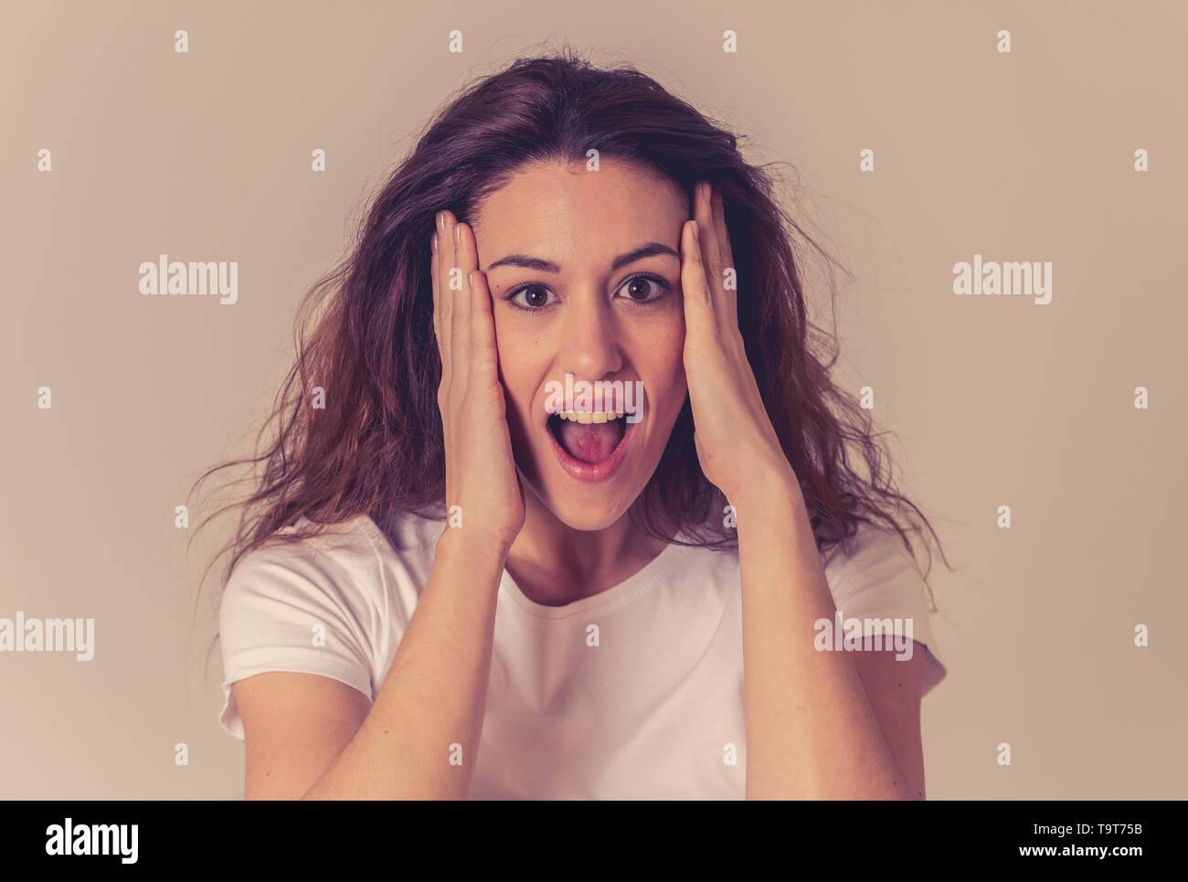 Beautiful young red hired woman with happy face making surprised ...