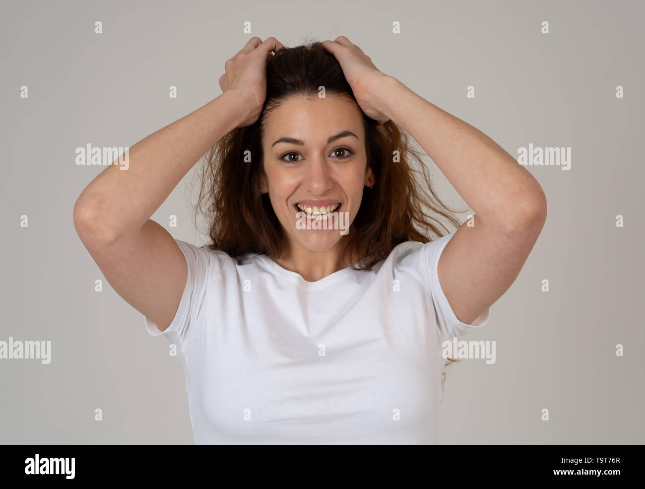 Portrait of beautiful shocked woman winning or having great success ...