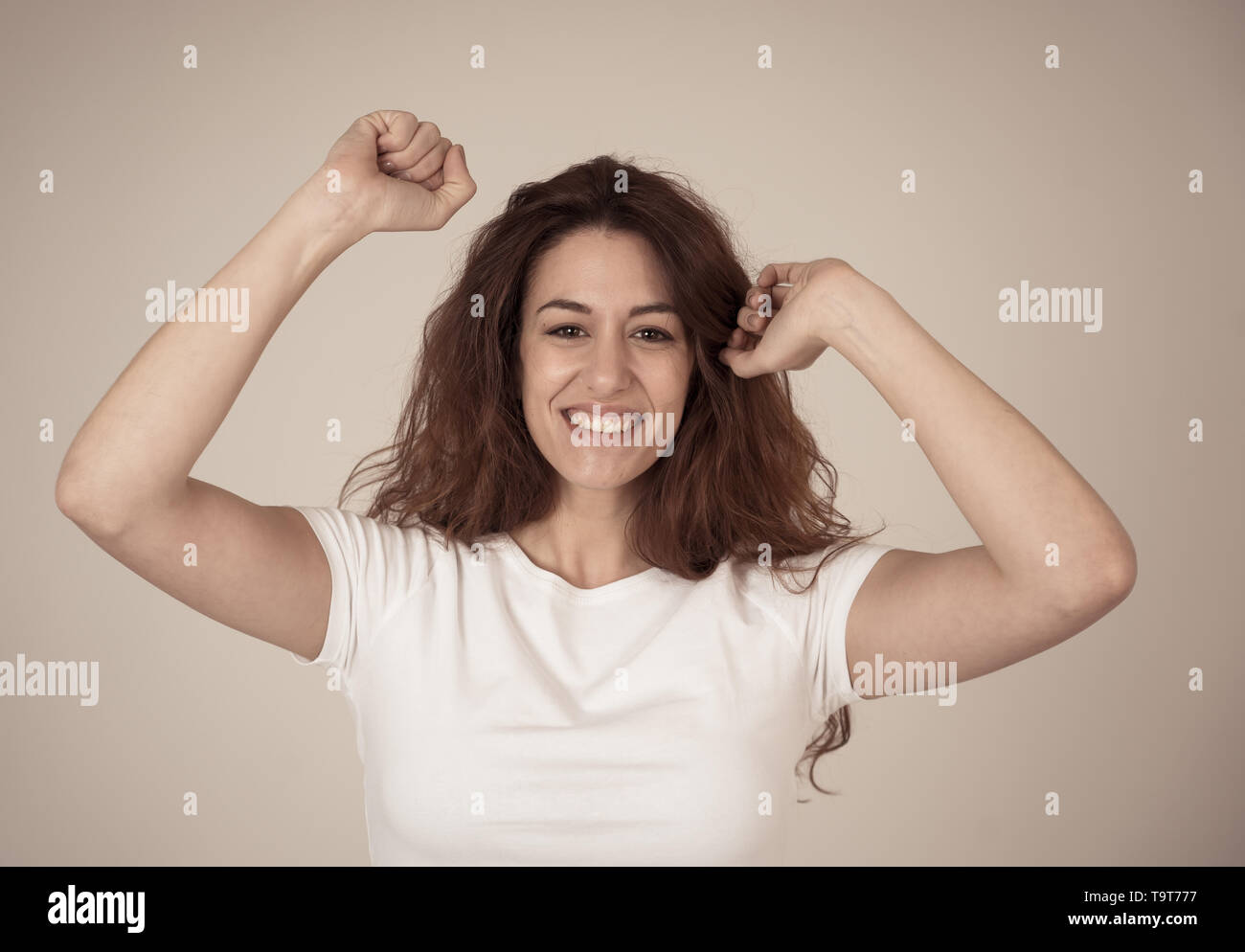 Portrait of beautiful shocked woman winning or having great success ...