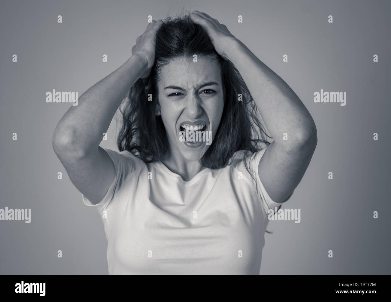 Portrait of beautiful shocked woman winning or having great success ...