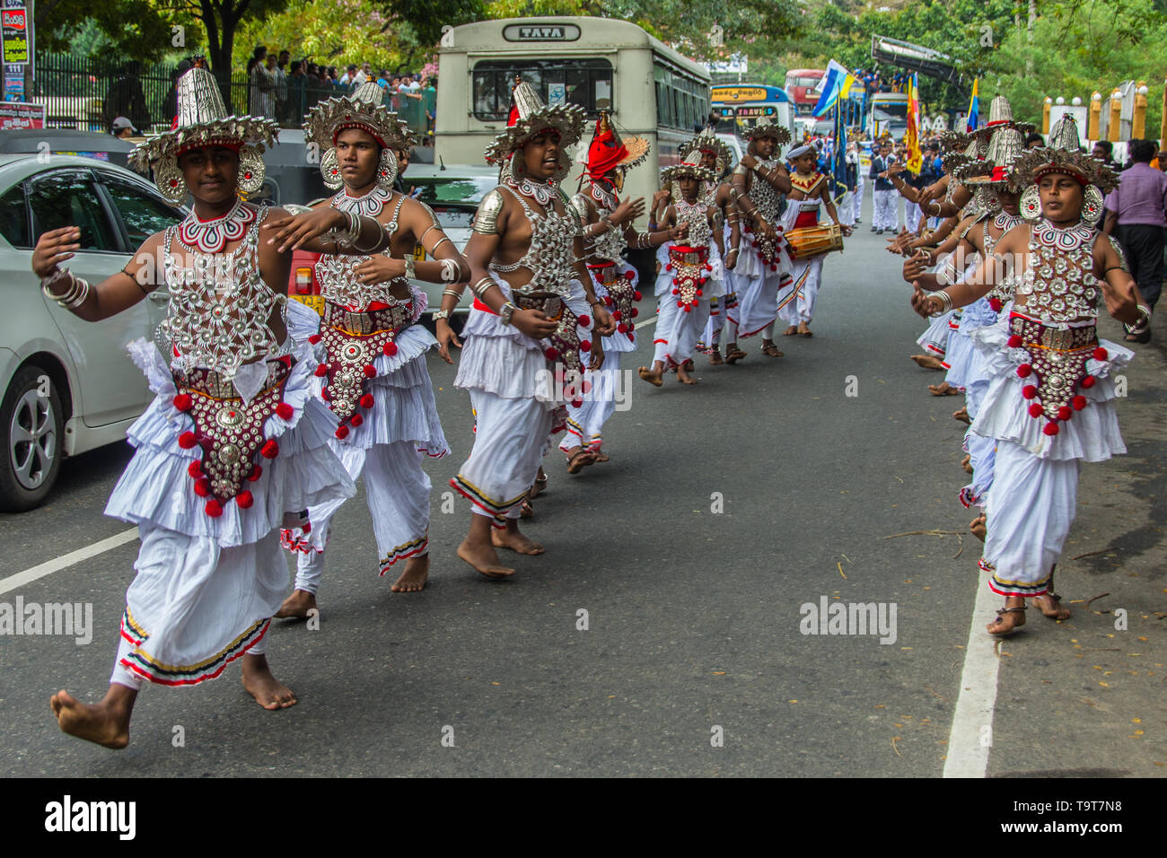 Traditional dancers parade through the streets of Kandy, Sri Lanka ...