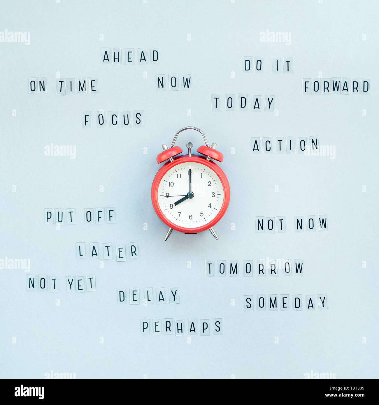 Creative top view flat lay of alarm clock with messages about delay or ...